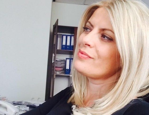 The former police spokeswoman, Sabrie Kamberi, is separated from her ...