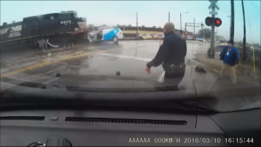 Watch how the policeman helps the driver escape from the railway before ...