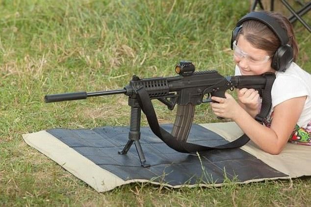 Parents proudly post images of their children holding different weapons ...