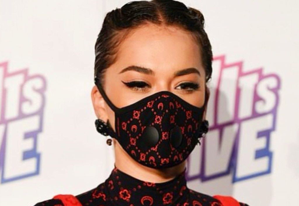 Rita gets attention as she appears in a mask on 'Hits Radio Live ...
