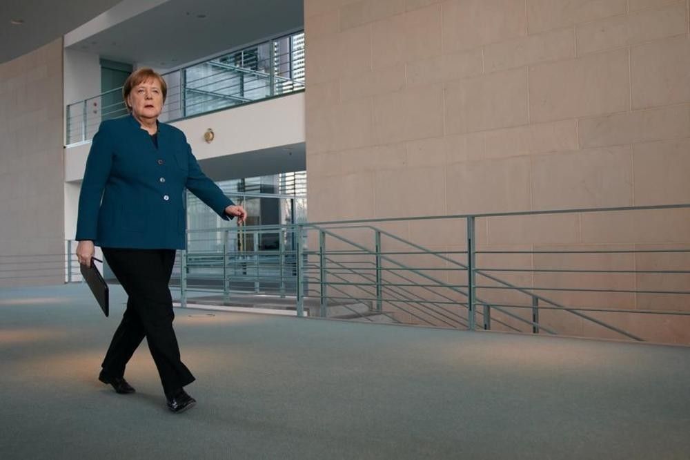 Angela Merkel is back in the office, returning to work after a two-week ...