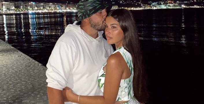 Elita Rudi poses happily next to Gjiko, while making a dedication to ...