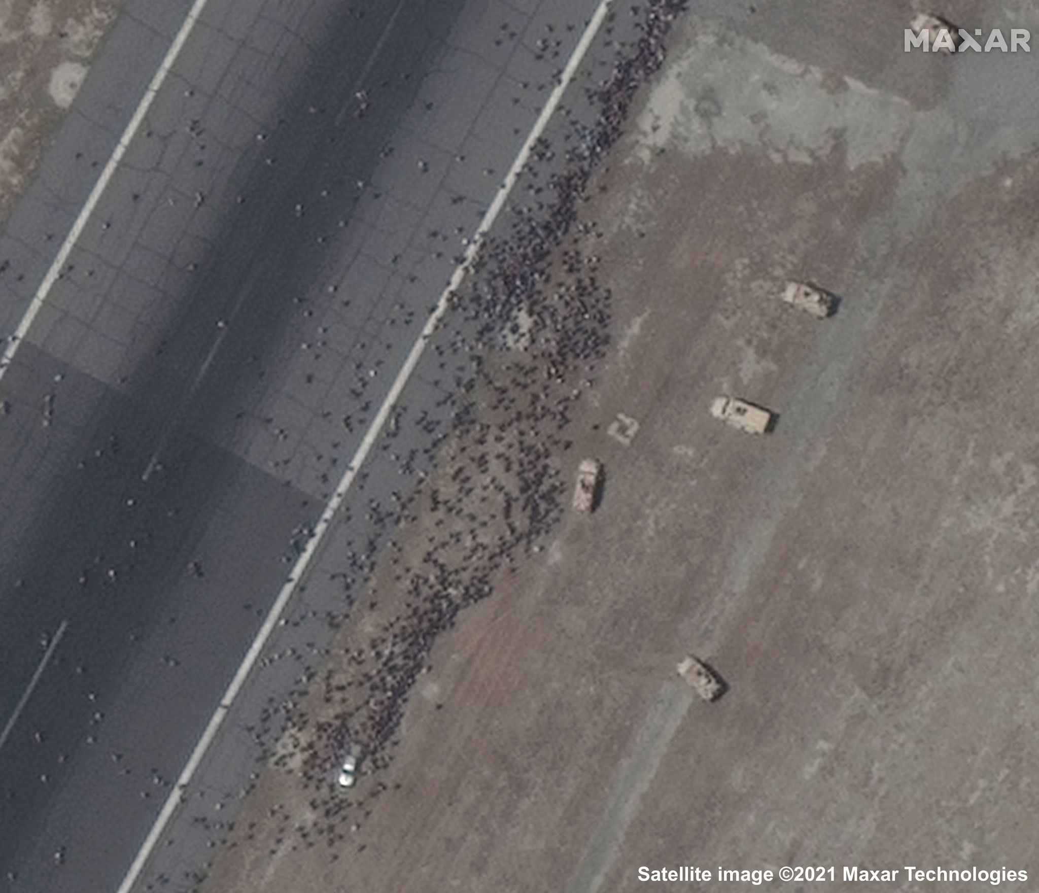 Satellite images show the chaotic situation at Kabul airport, after the ...
