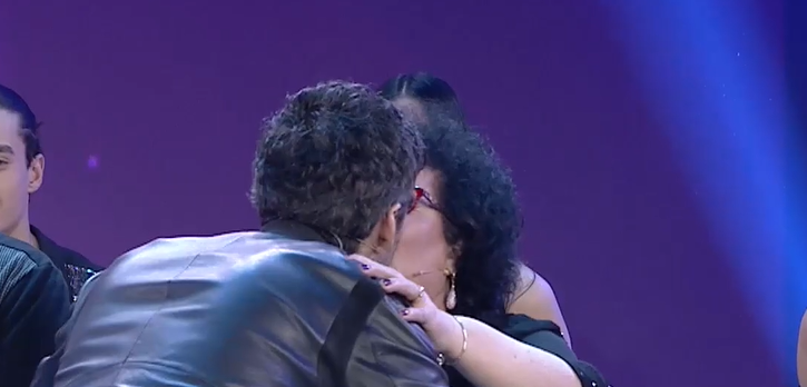 Actor Nik Xhelilaj kisses Irini Qirjako on the lips during a game in a ...