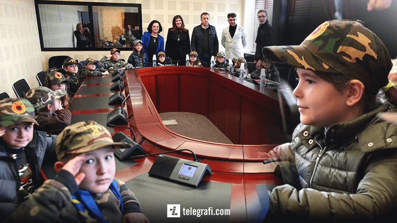 In military uniforms and with KLA emblems, students from Drenas visit ...