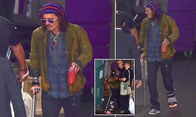 Johnny Depp is photographed with crutches and a cast after the leg ...