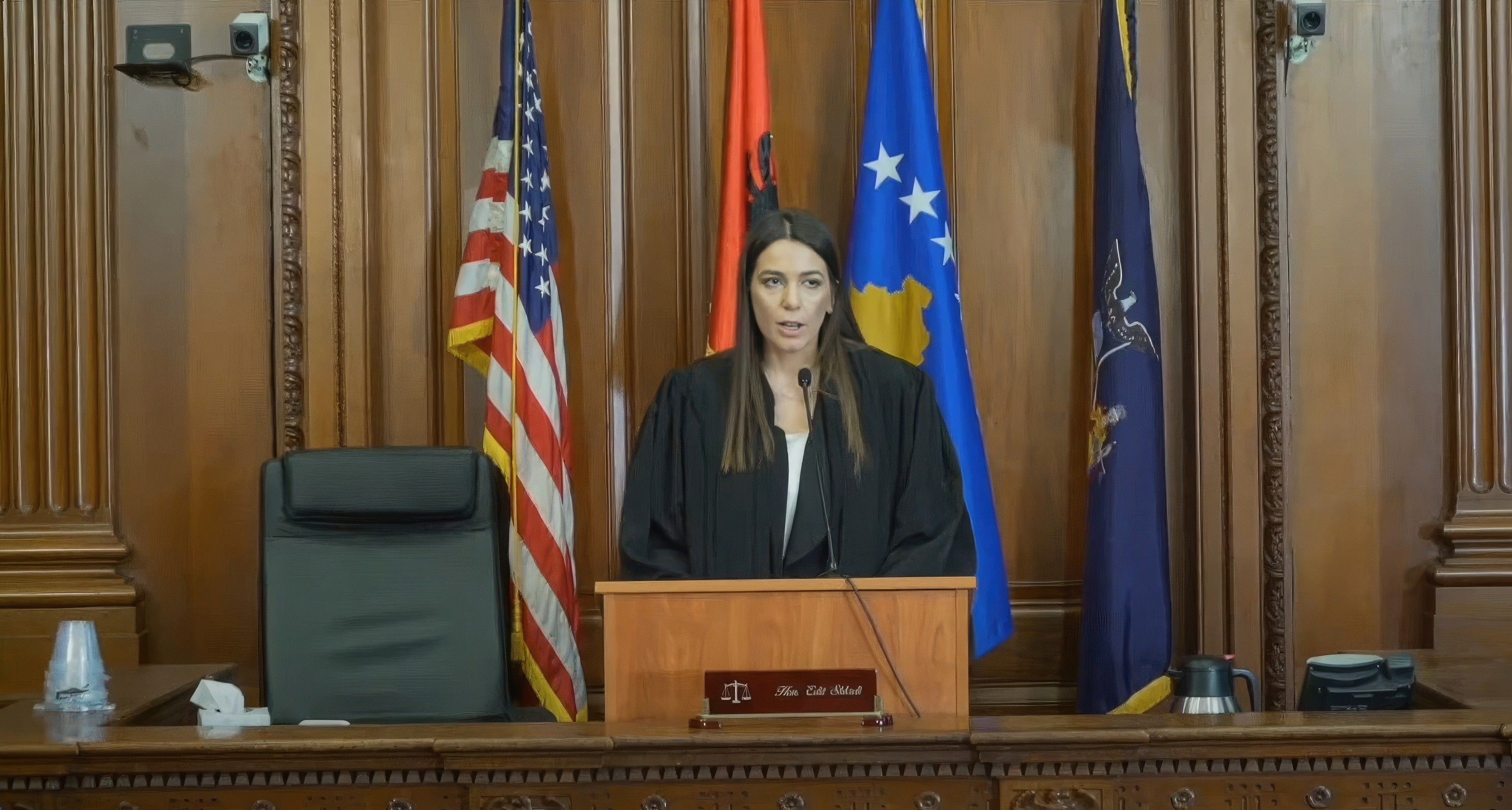 Under the intonation of the Albanian national anthem, Edit Shkreli is ...