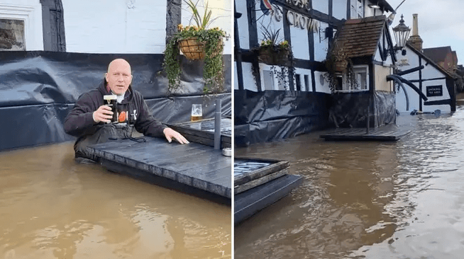 The owner of a cafe-bar enjoys the drink in the flood waters in Great ...