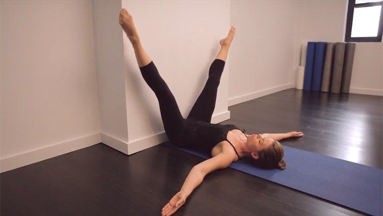 Exercise near the wall for slimming the inner and outer sides of the ...