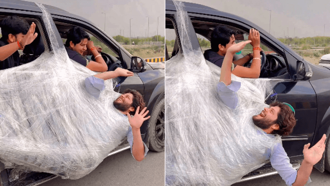 Dangerous stunt - man enjoys driving wrapped in nylon and hanging on ...