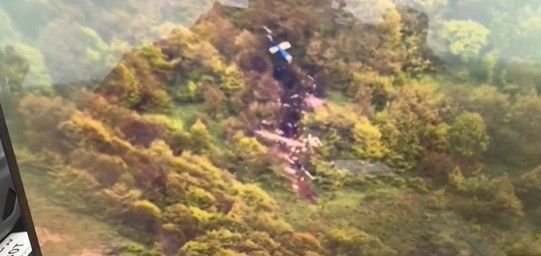 Drone footage shows the pieces of the downed helicopter of the Iranian ...