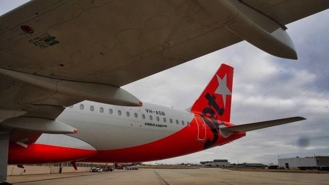 Pilot forced to 'turn around' after woman tries to open door while ...